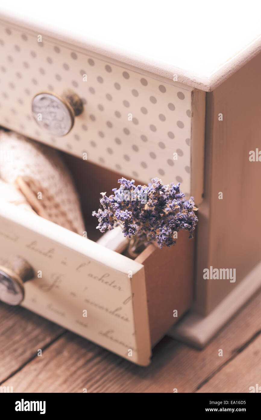 Bunch of dry lavender in decorative little shabby chic chest of drawers ...
