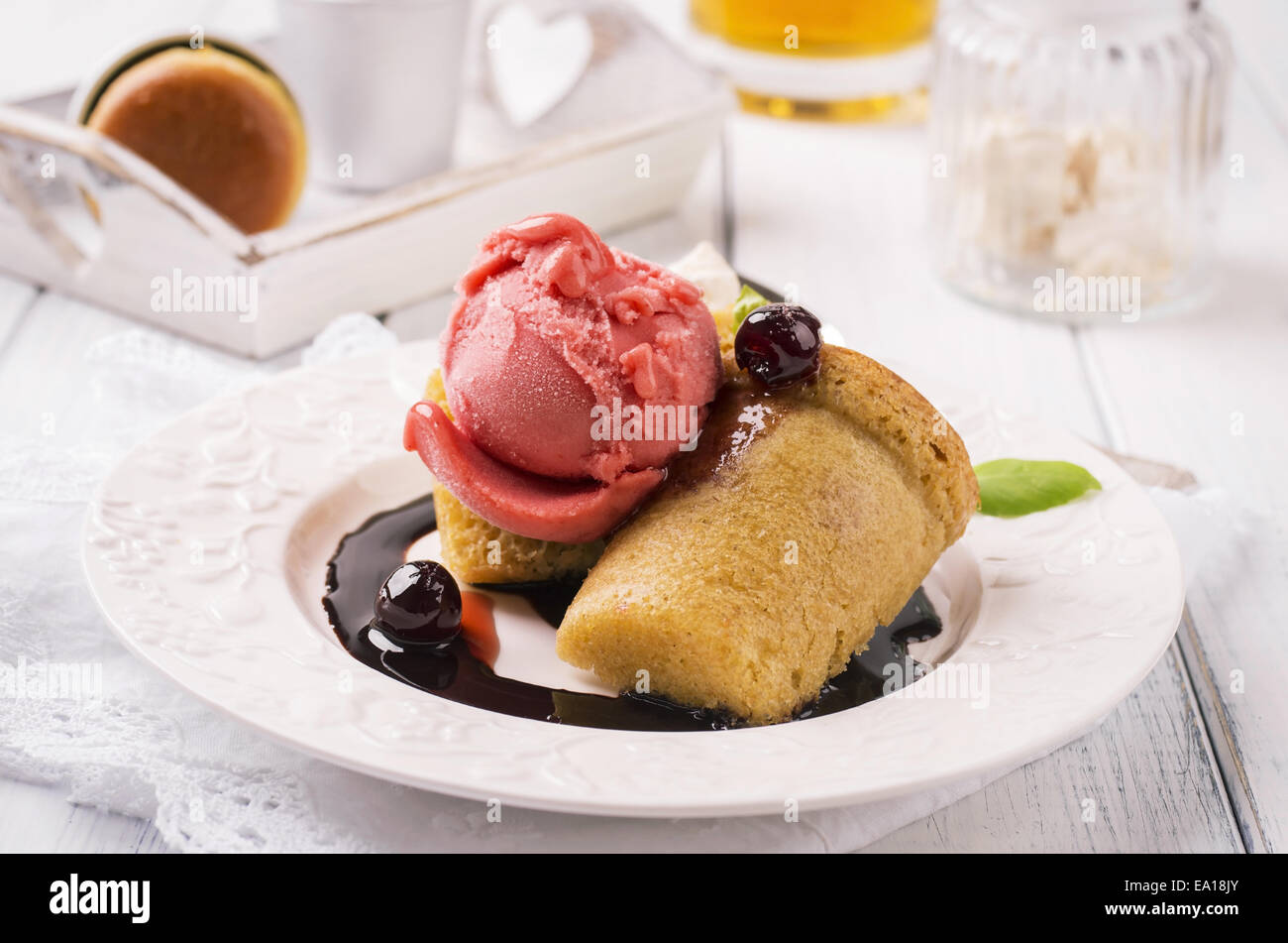 rhum baba with ice cream Stock Photo - Alamy