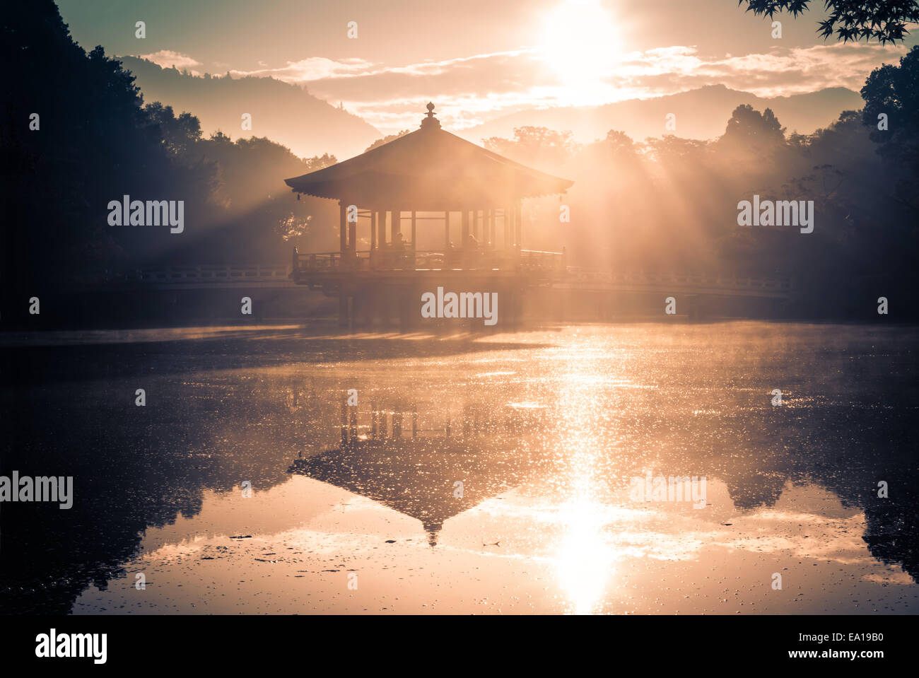 Sepia landscape of a Japanese wooden pavilion in a pond in Japan at ...