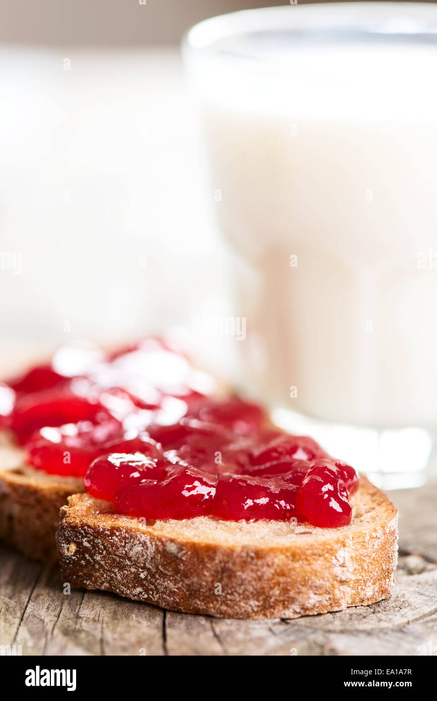 Bread with strawberry jam closeup Stock Photo - Alamy