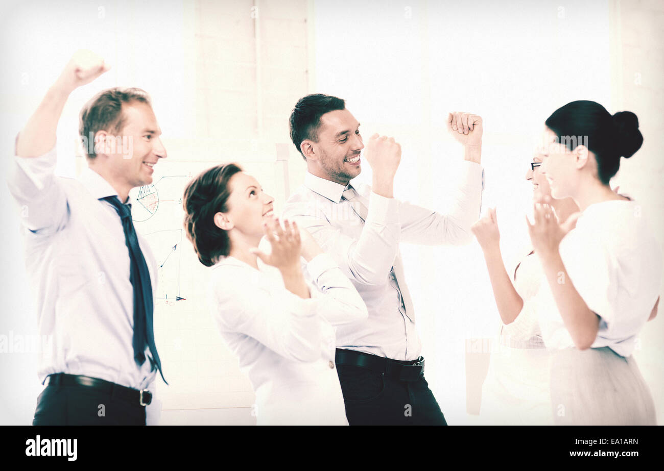 business team celebrating victory in office Stock Photo - Alamy