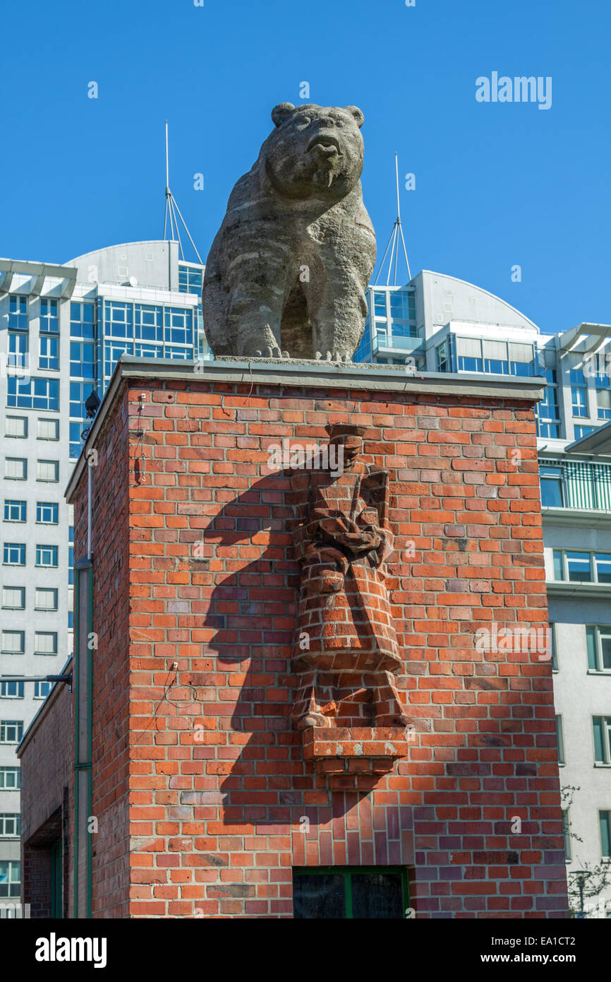 Bear and worker Stock Photo - Alamy