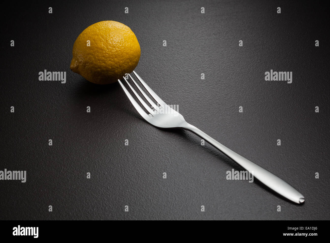 Lemon on fork hi-res stock photography and images - Alamy