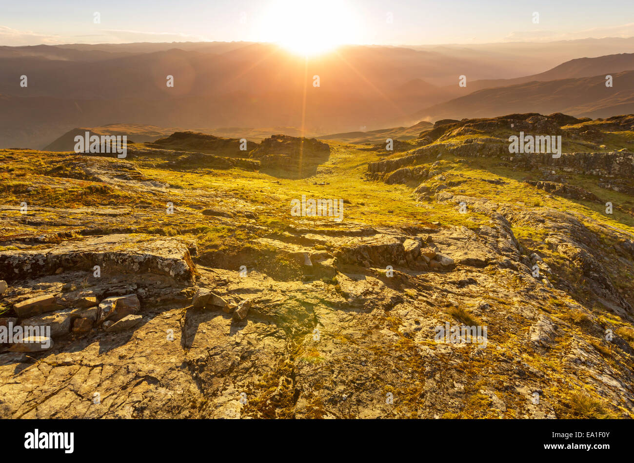 Sunset in mountains Stock Photo - Alamy