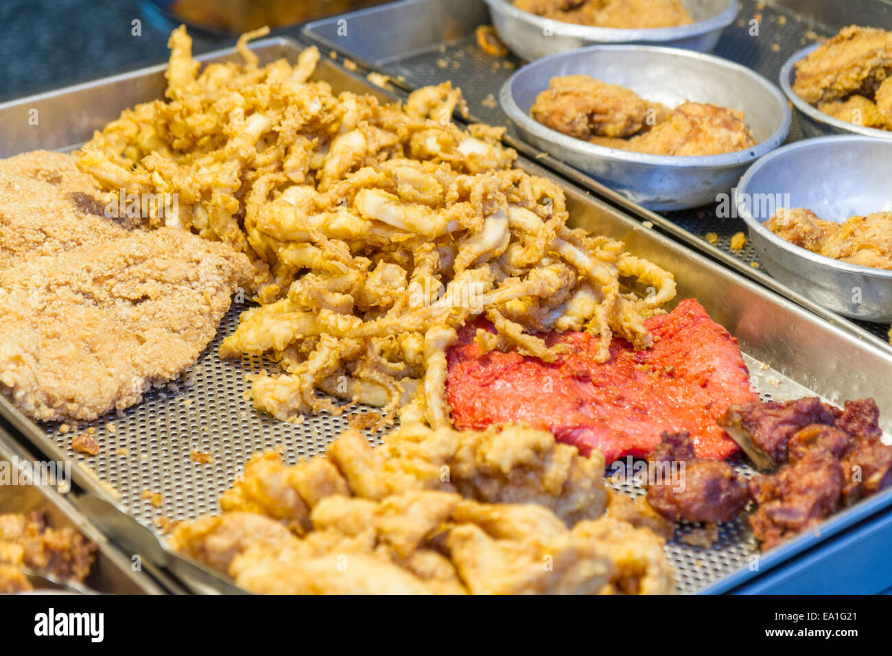 Taiwanese fried chicken and squid at traditional market in Taipei Stock ...