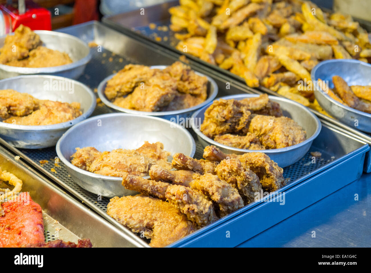 Taiwanese fried chicken and squid at traditional market in Taipei Stock ...