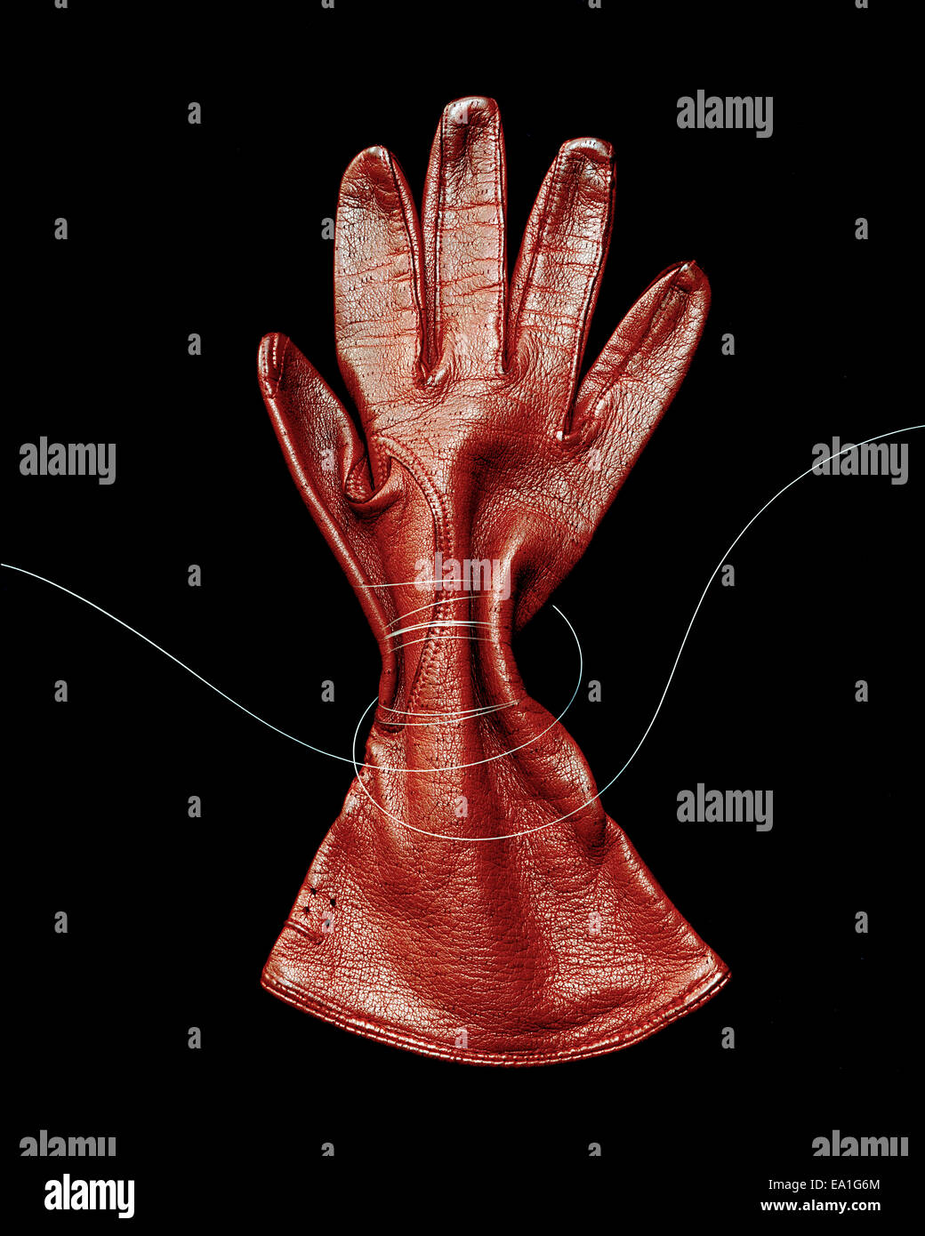 A leather glove wrapped in a piece of string Stock Photo - Alamy