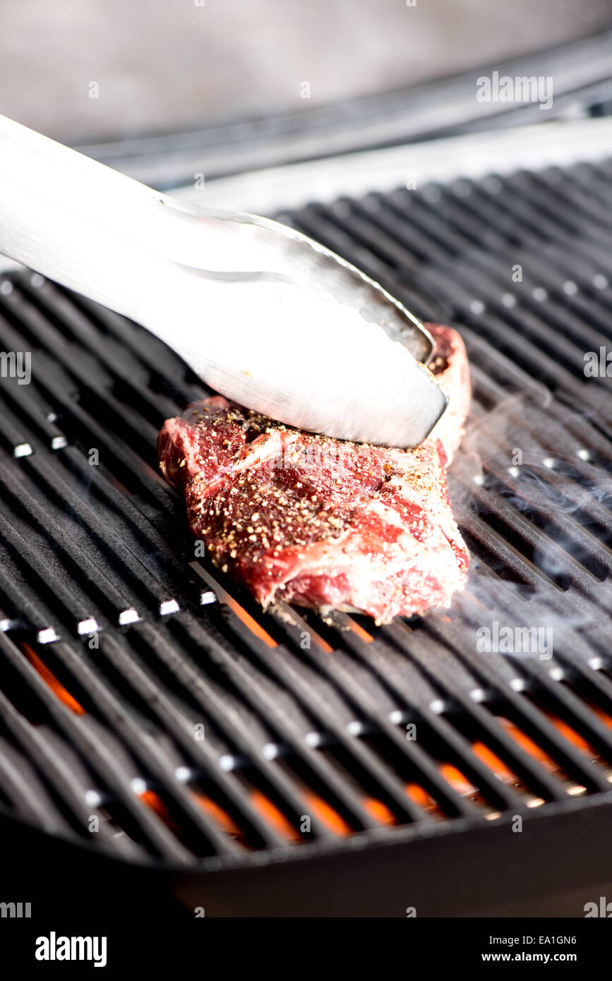 Grilling beef steak on bbq hi-res stock photography and images - Alamy