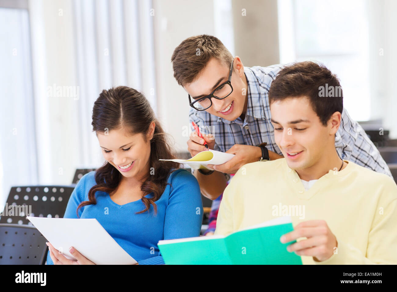 group of smiling students with notebooks Stock Photo - Alamy