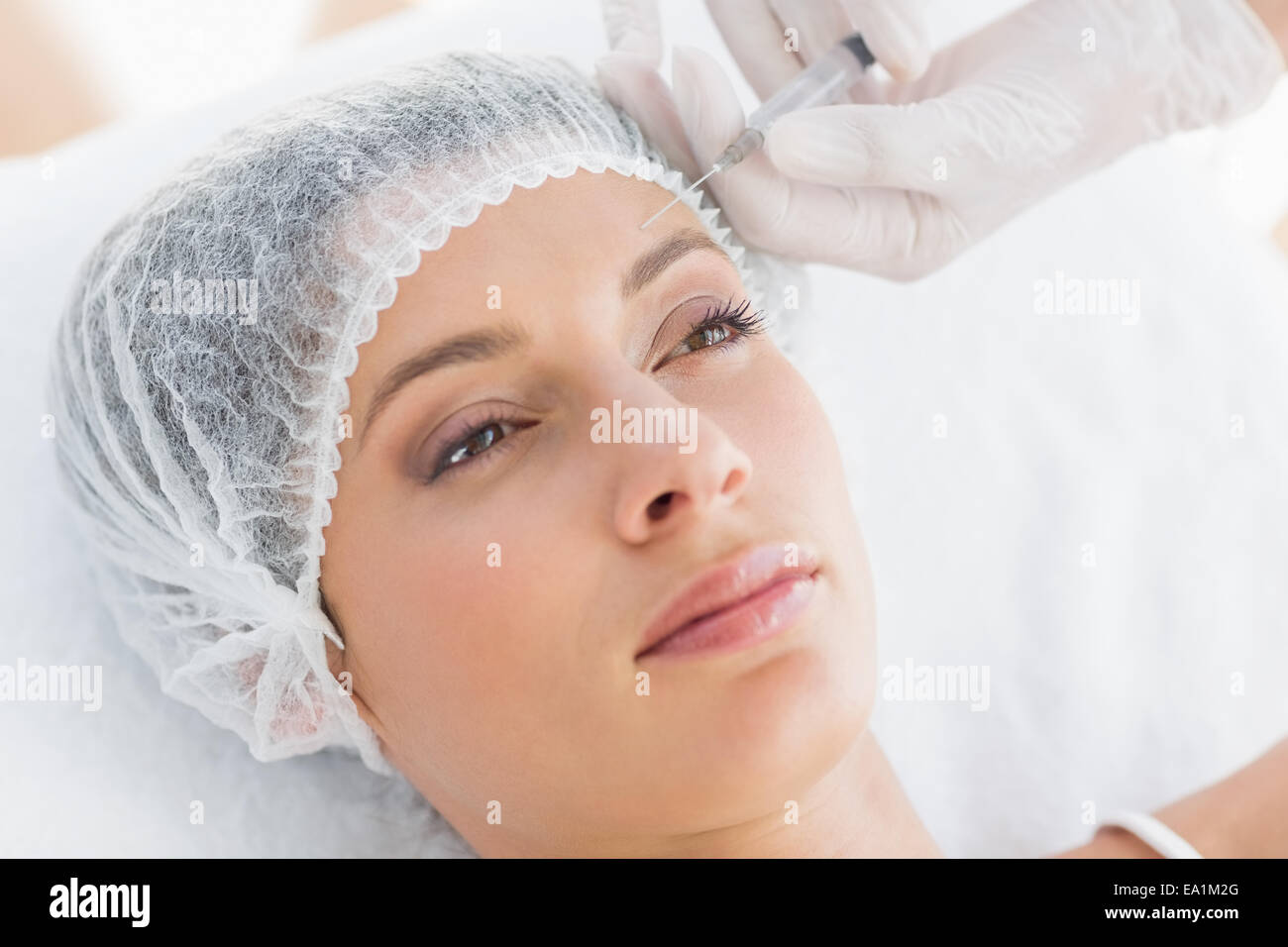 Beautiful woman receiving botox injection Stock Photo - Alamy