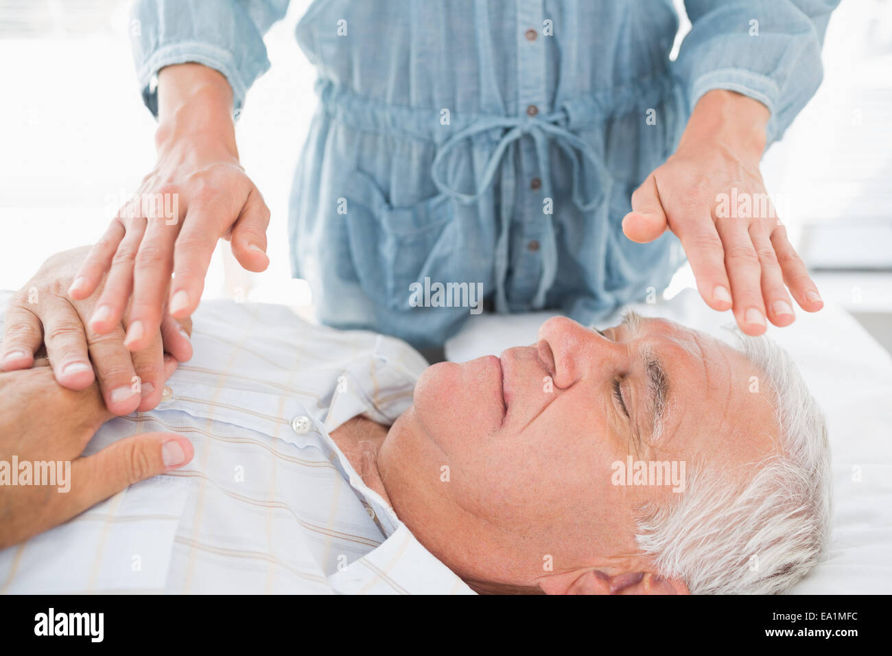 Man reiki hi-res stock photography and images - Alamy