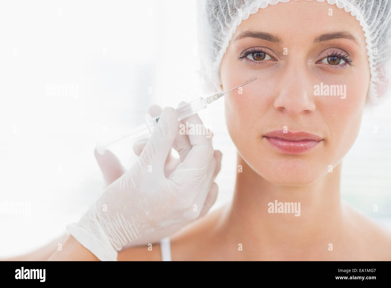 Beautiful woman having botox injection Stock Photo - Alamy