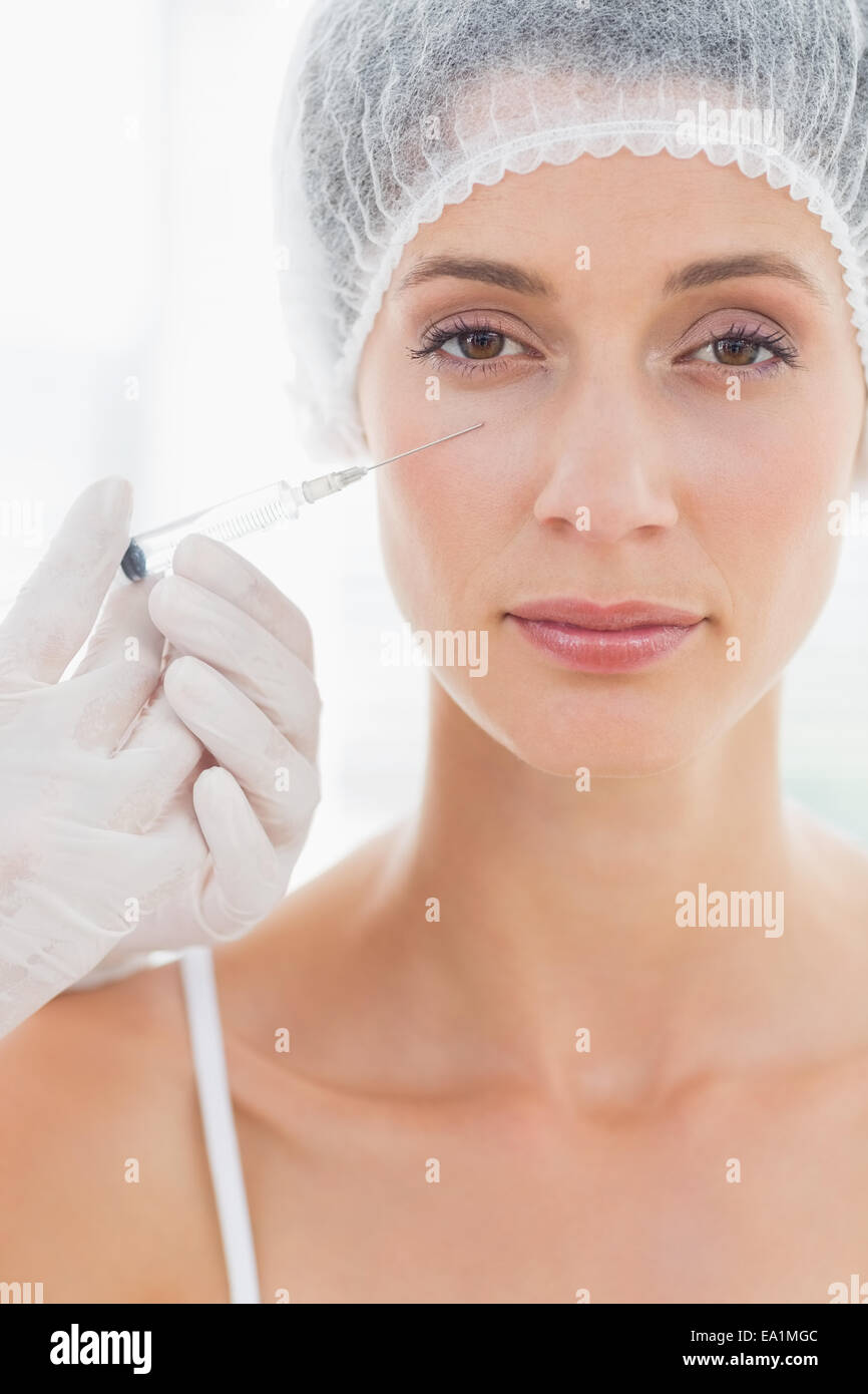 Attractive woman having botox injection Stock Photo - Alamy