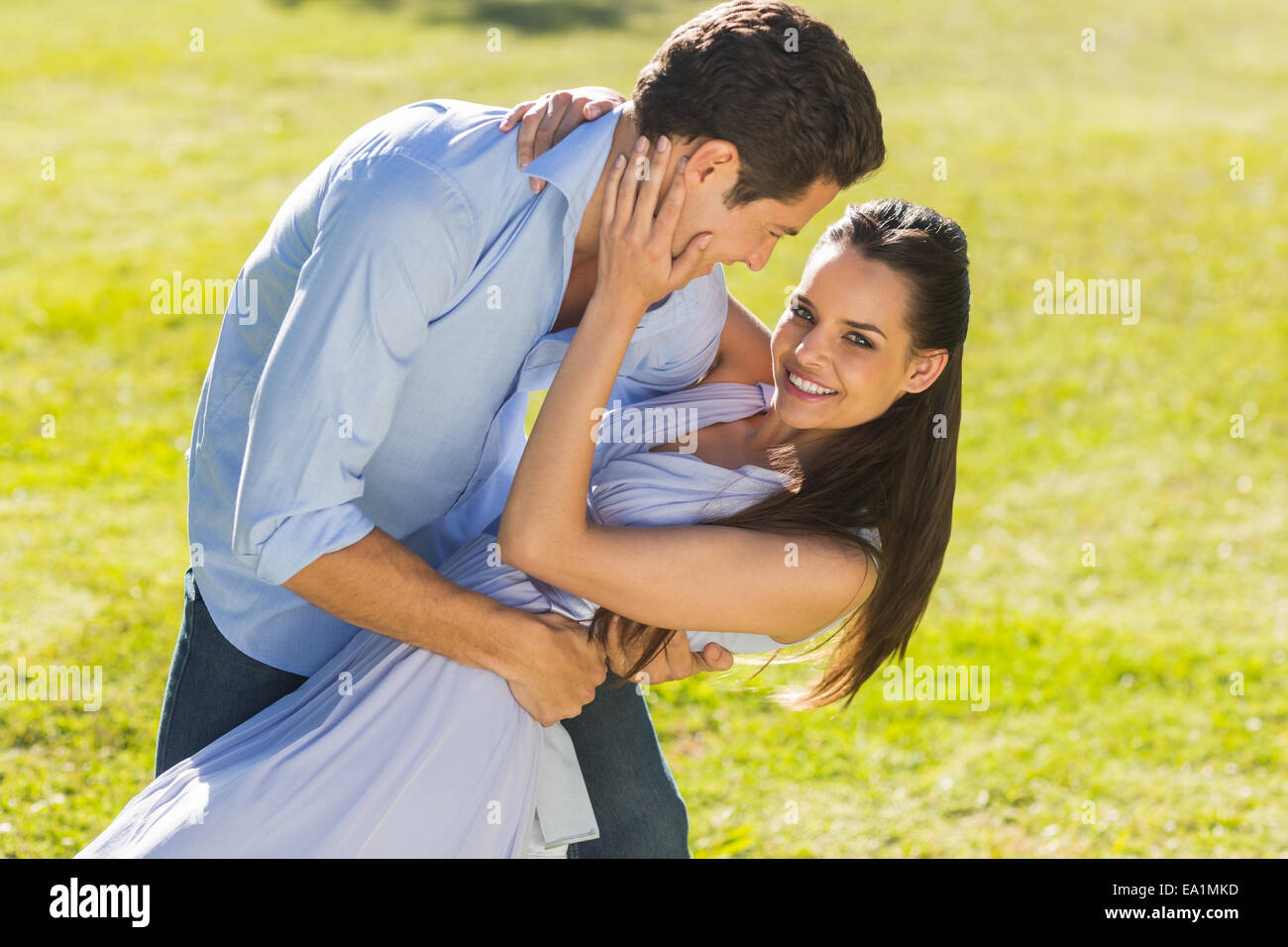 Loving and happy couple dancing in park Stock Photo - Alamy