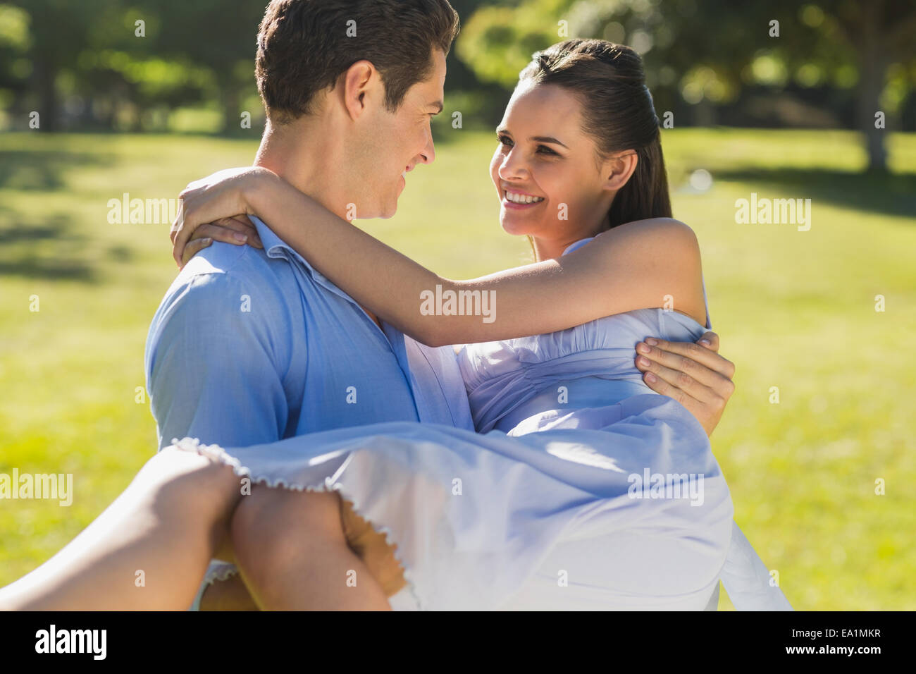 Romantic man carrying woman in hi-res stock photography and images - Alamy