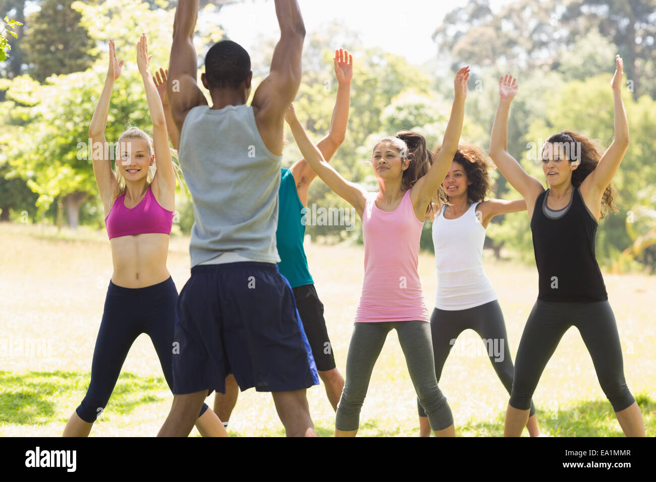 Group of young friends out in the park together hi-res stock ...