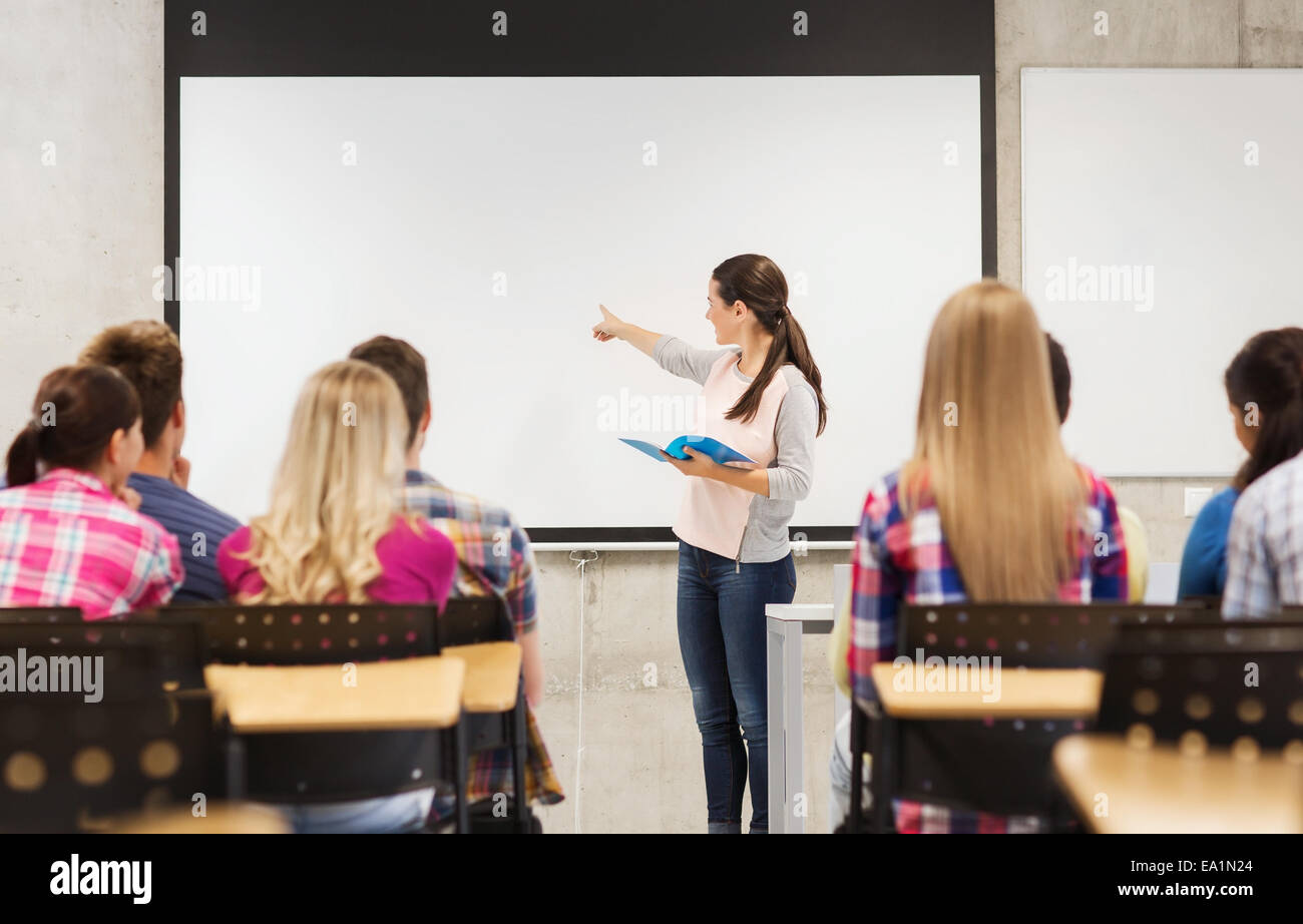 group of smiling students in classroom Stock Photo - Alamy