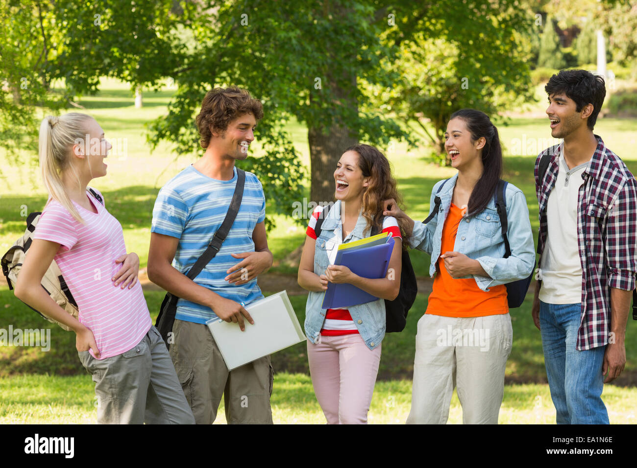 Group of cheerful college friends in campus Stock Photo - Alamy