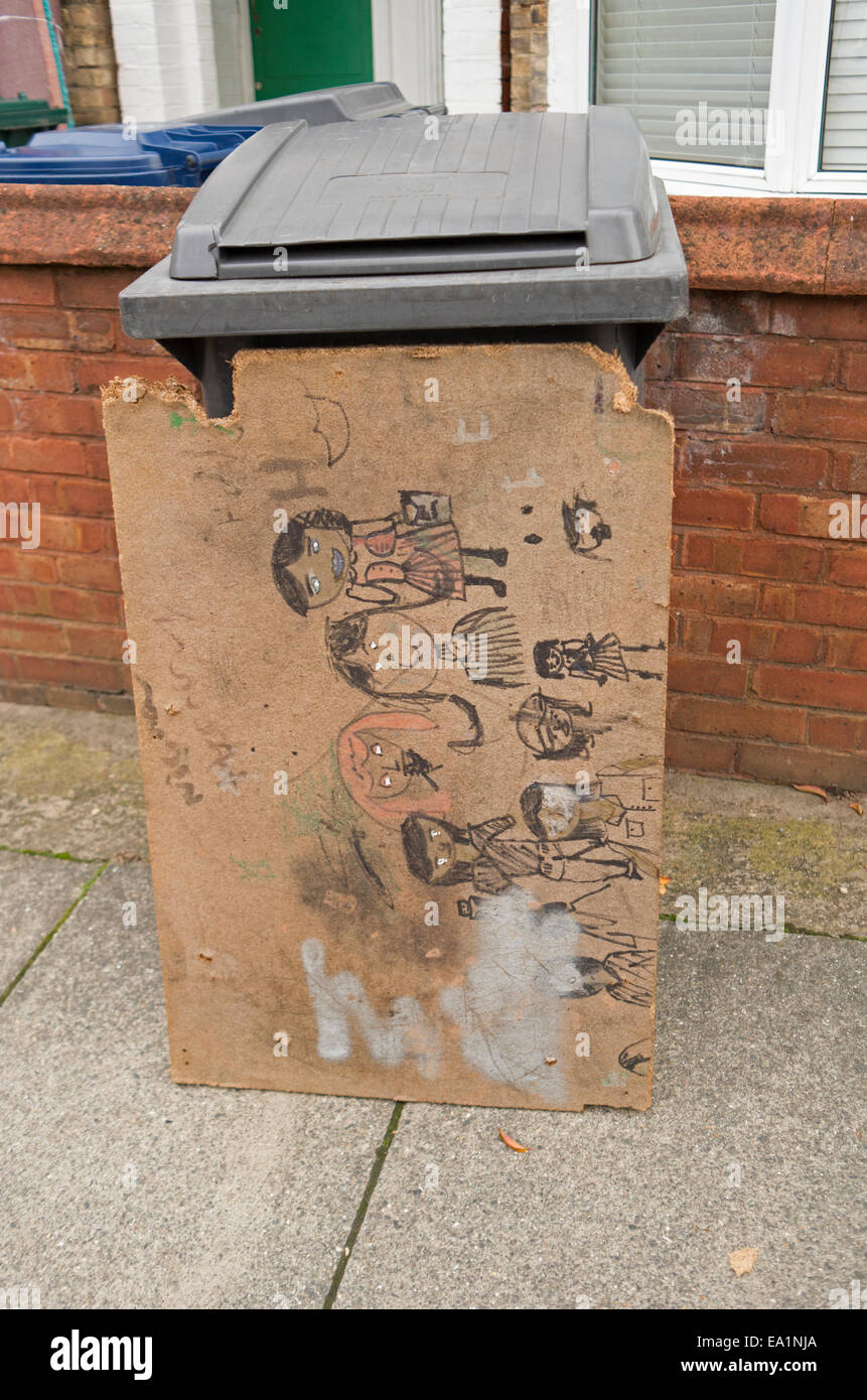 A family portrait drawn by a child is left out with the rubbish Stock ...