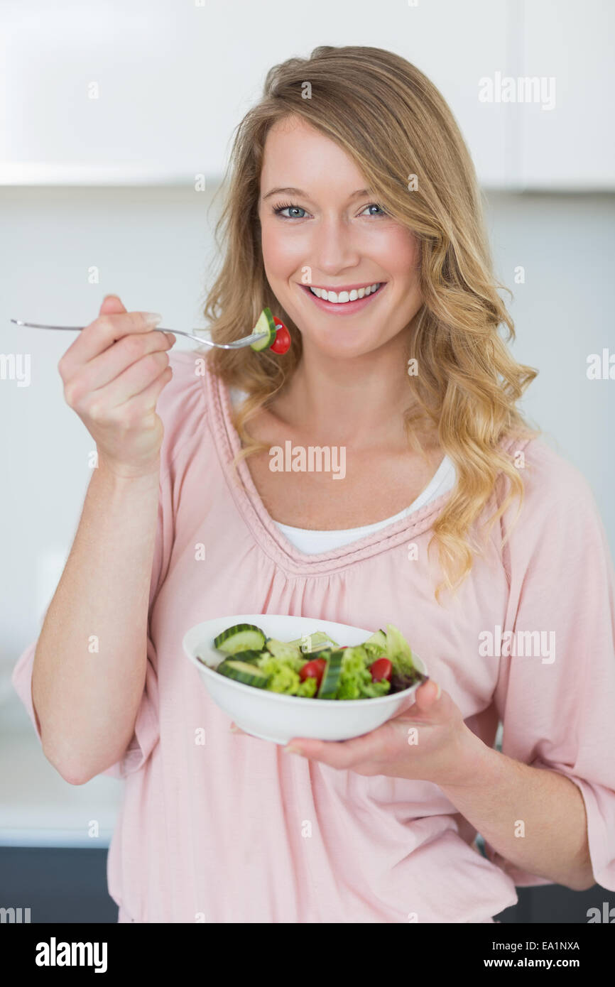 Woman eating salad hi-res stock photography and images - Alamy