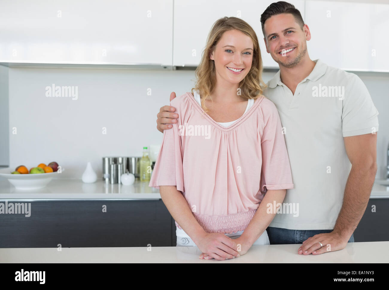 Couple standing at kitchen counter Stock Photo - Alamy