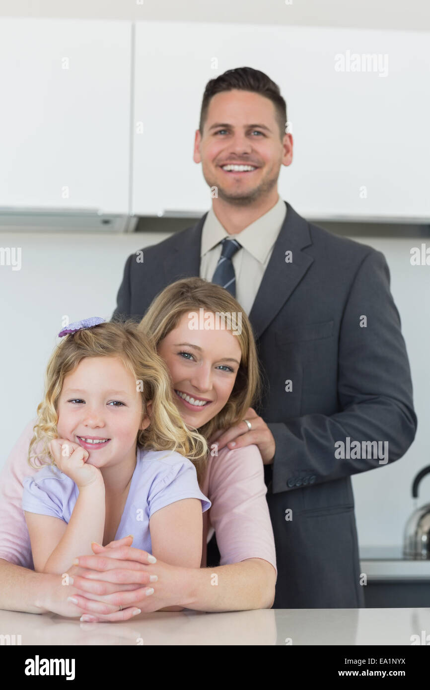 Family smiling together at table Stock Photo - Alamy