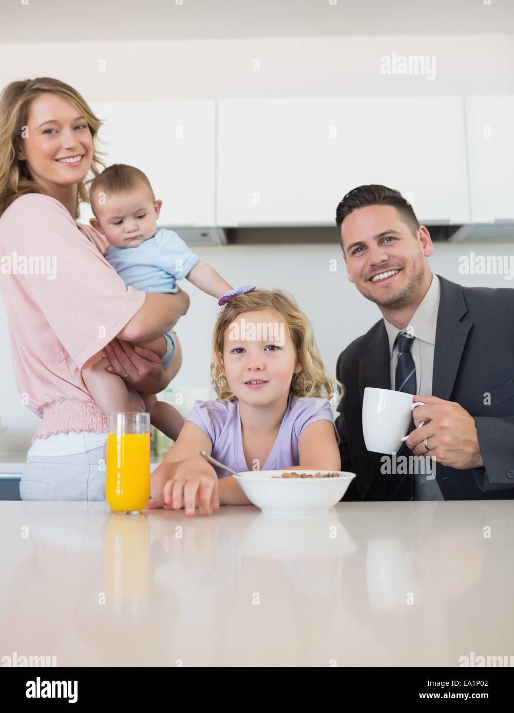 Family at breakfast table in house Stock Photo - Alamy