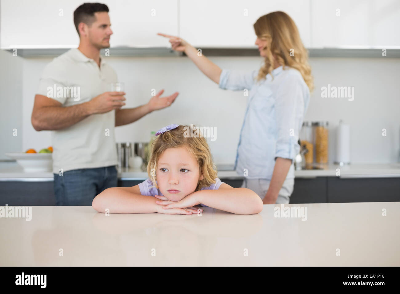 Sad girl against arguing parents Stock Photo - Alamy