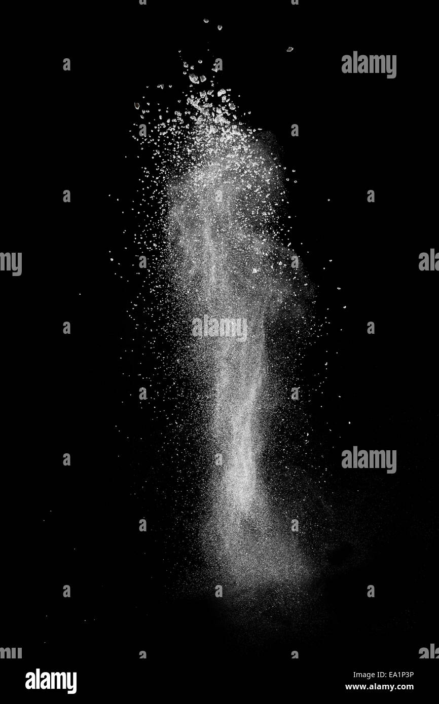 White powder explosion isolated on black Stock Photo - Alamy