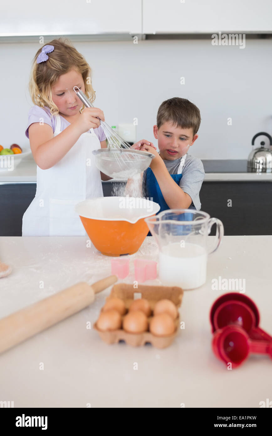 Children preparing cookies in hi-res stock photography and images - Alamy