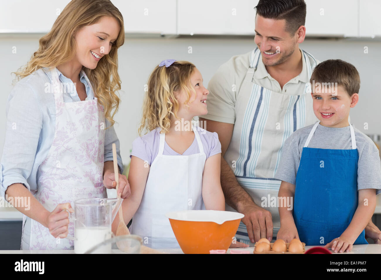 Family baking cookies together in kitchen Stock Photo - Alamy
