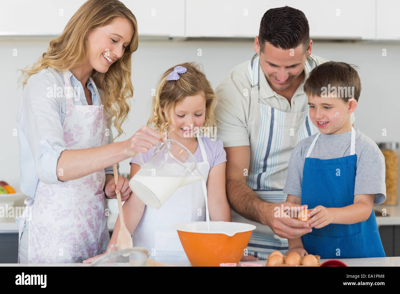 Family making cookies together in kitchen Stock Photo - Alamy