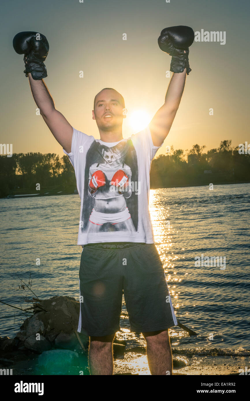 Men with boxing gloves at a river Stock Photo - Alamy