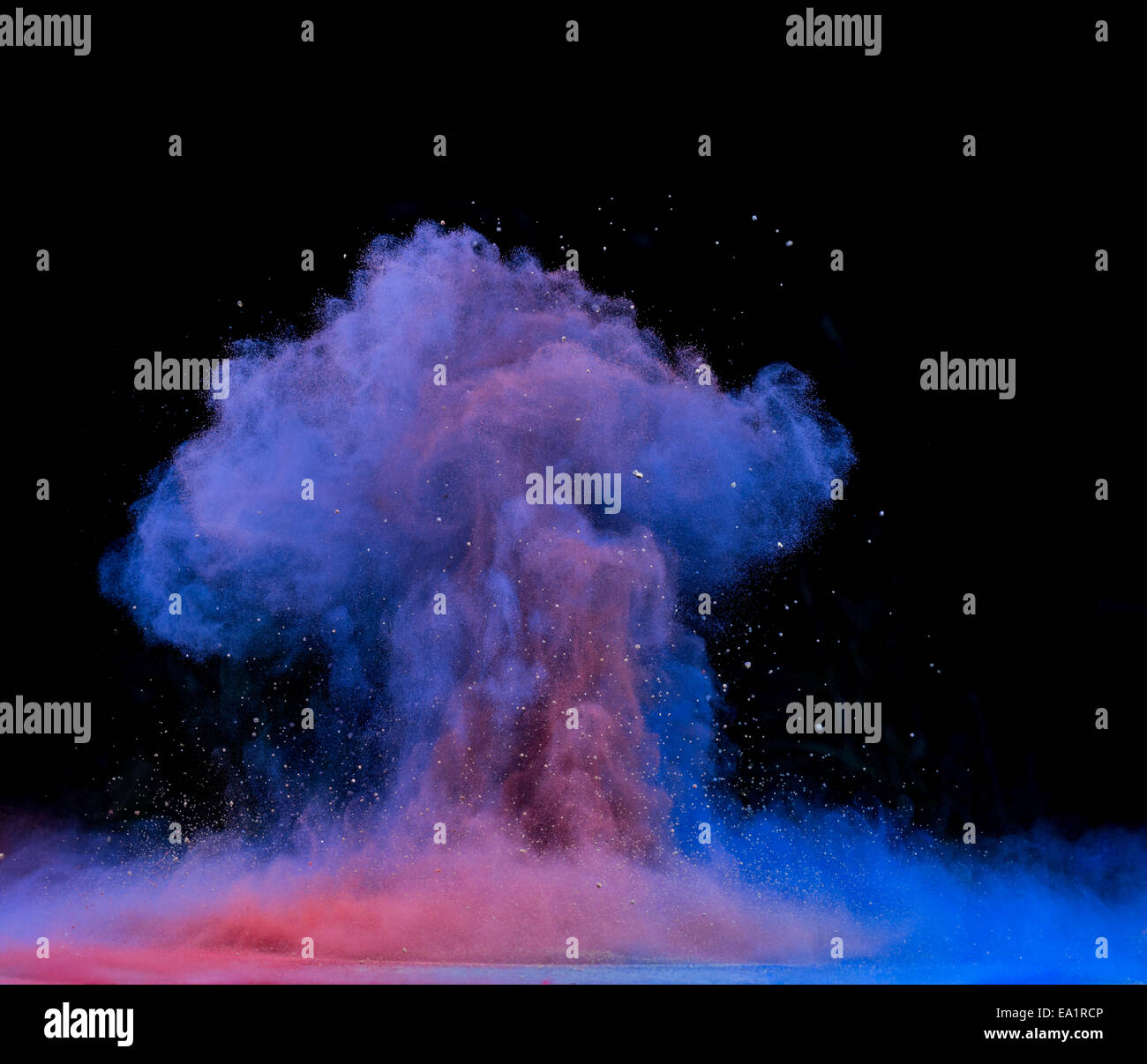 Freeze motion of colored dust explosion isolated on black background ...