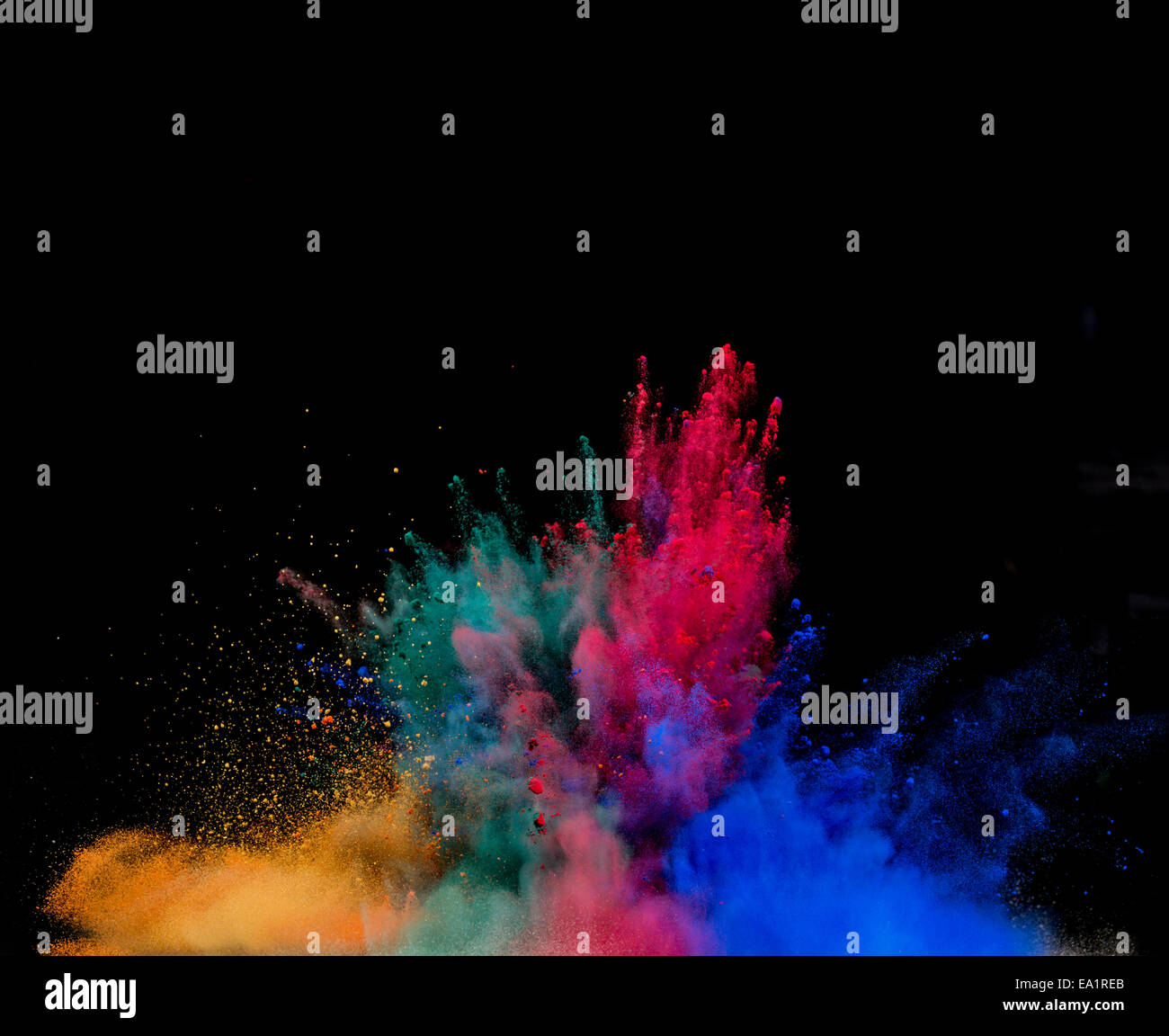 Freeze motion of colored dust explosion isolated on black background ...