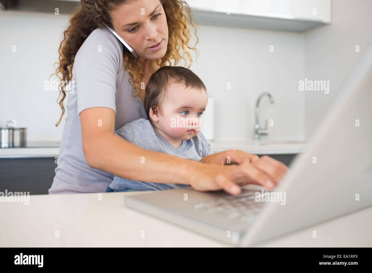 Multi tasking woman hi-res stock photography and images - Alamy
