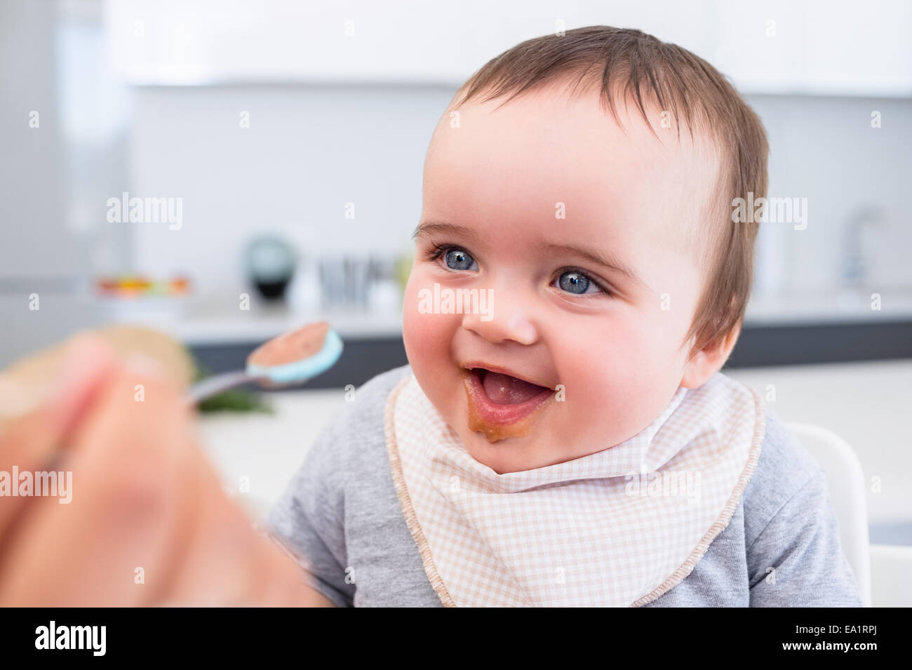 Baby boy being fed by mother Stock Photo - Alamy