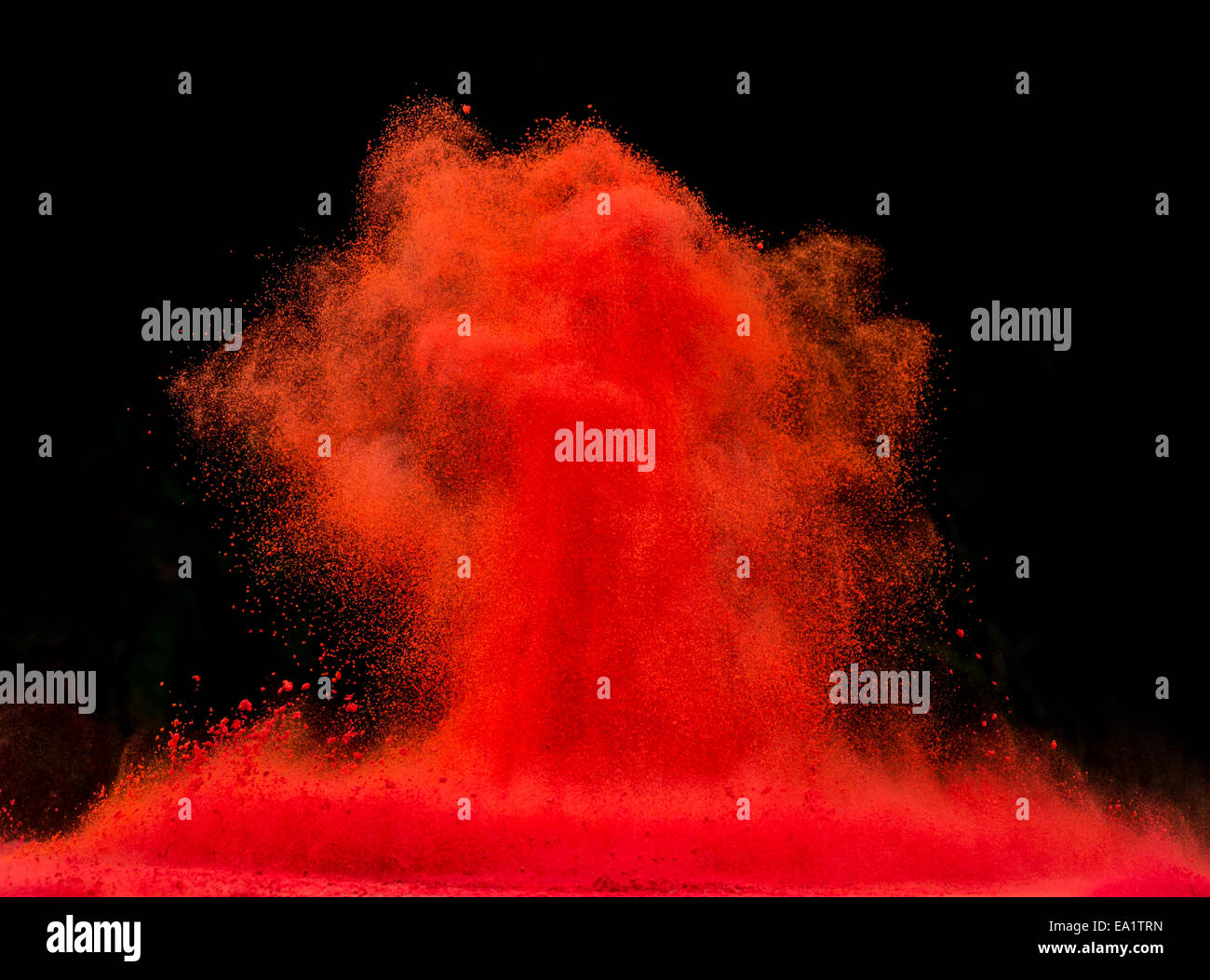 Freeze motion of red dust explosion isolated on black background Stock ...