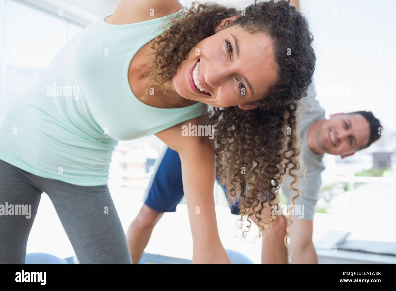 Woman stretching in exercise room Stock Photo - Alamy