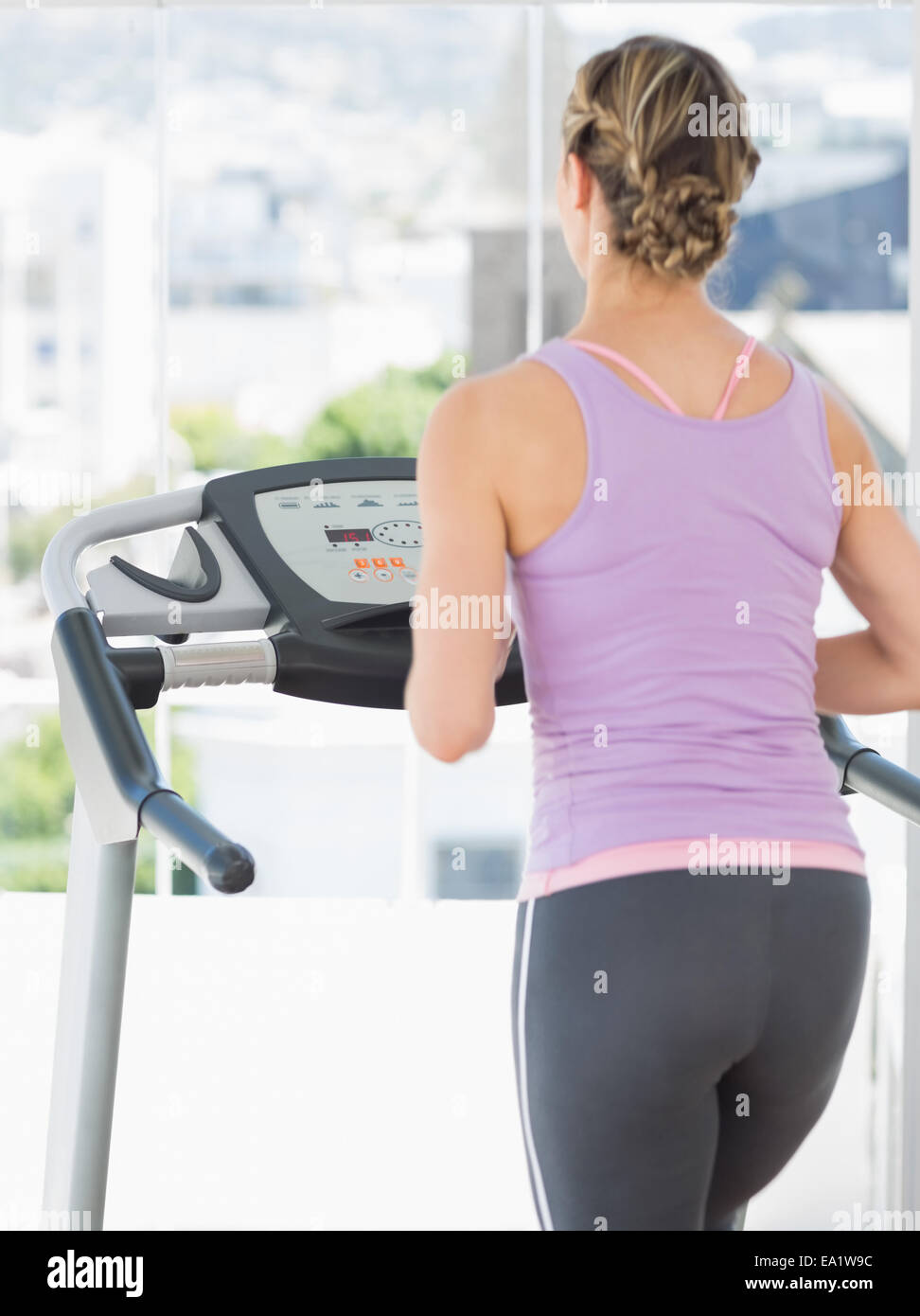 Woman exercising on treadmill Stock Photo - Alamy