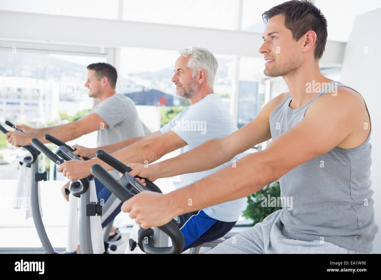 Men working out on exercise machines Stock Photo - Alamy