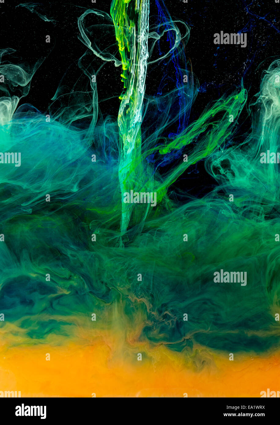 Studio shot of colored ink in water on black background Stock Photo - Alamy