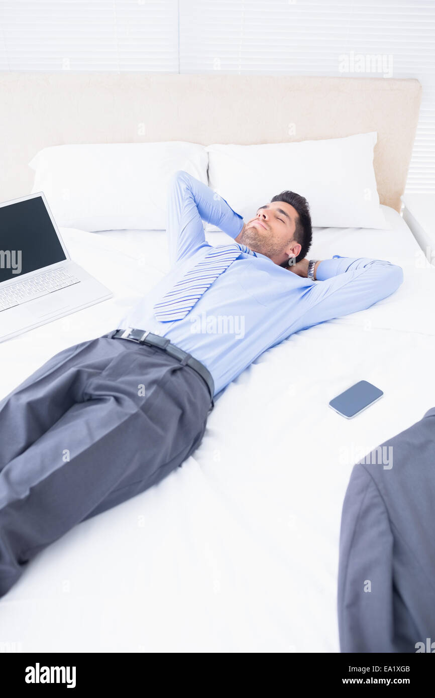 Businessman asleep bed hi-res stock photography and images - Alamy