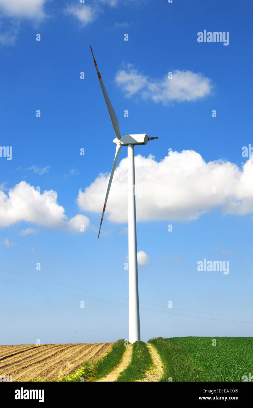 Windmill conceptual image. Windmill on the green field Stock Photo - Alamy