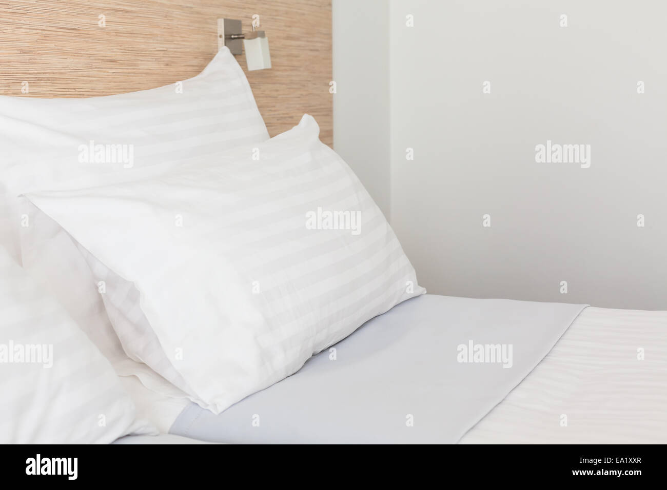 Prepared fresh bed, scene in hotel room. Horizontal shot Stock Photo ...