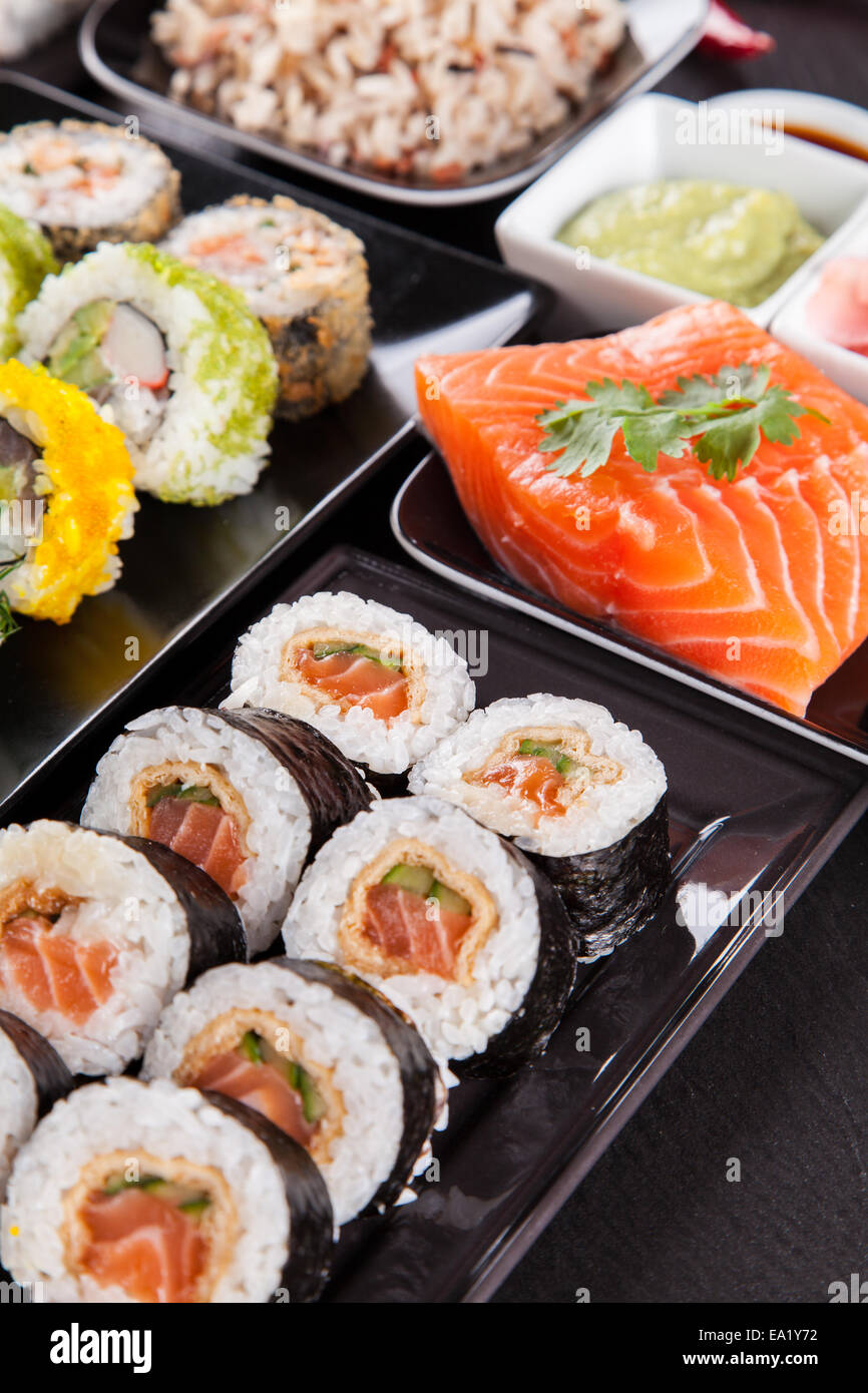 Various kinds of sushi food served on black stone Stock Photo - Alamy