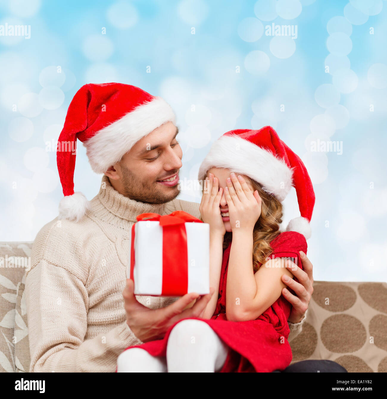 smiling daughter waiting for present from father Stock Photo - Alamy