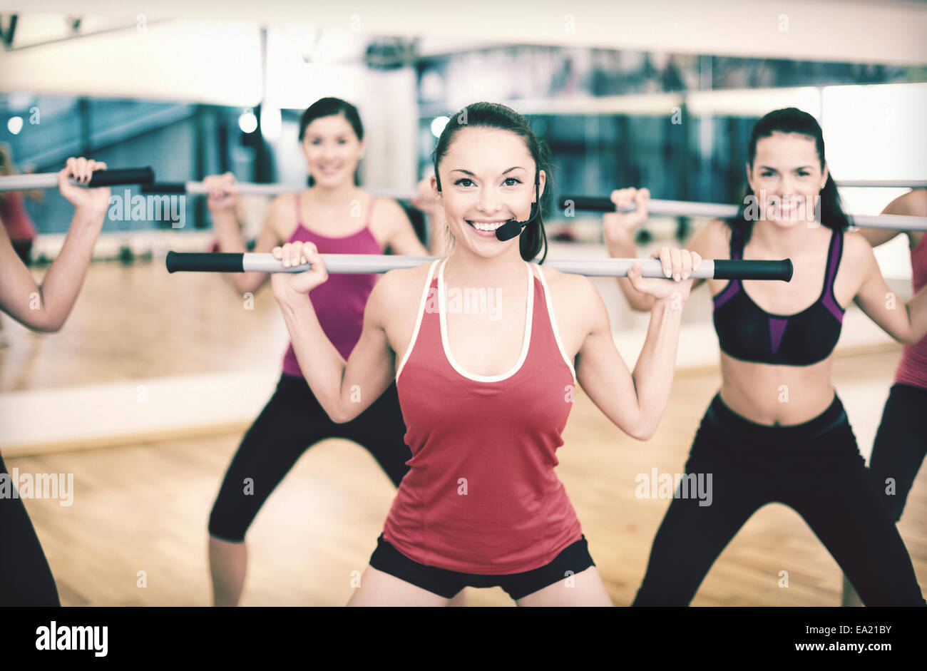 group of smiling people working out with barbells Stock Photo - Alamy
