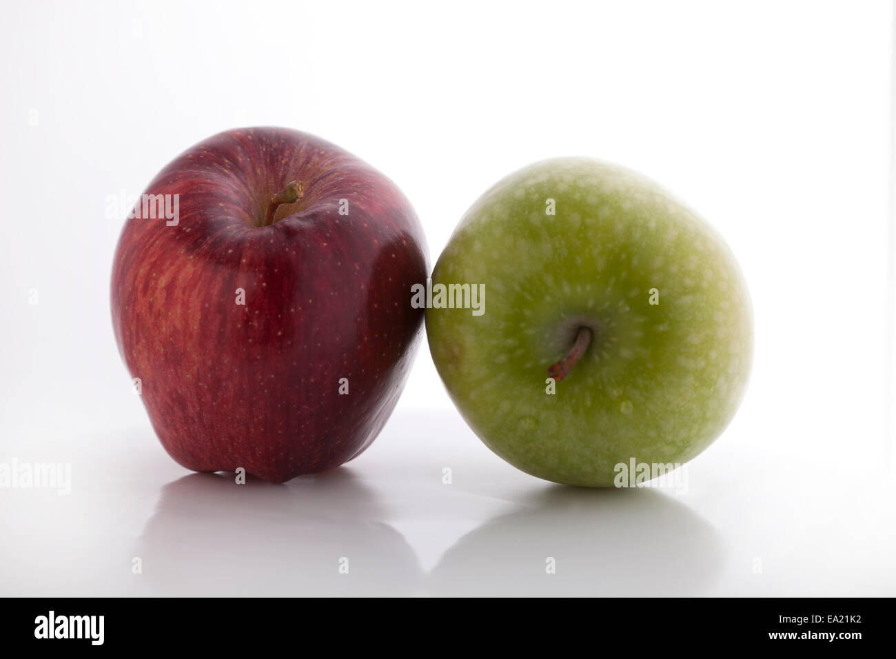Two apples, one red the other green Stock Photo - Alamy