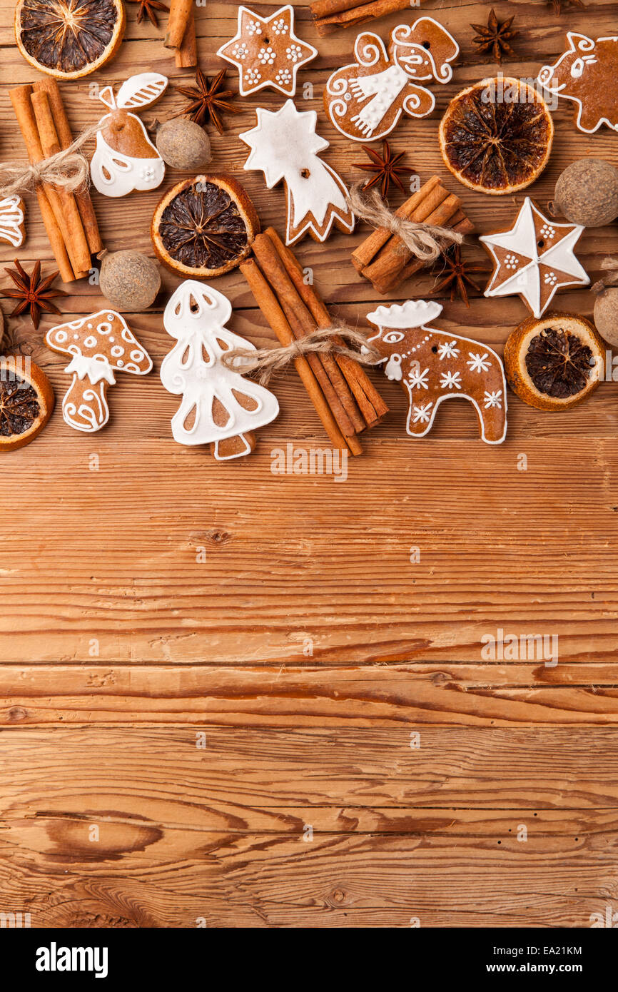 Traditional gingerbread hanging on wooden background Stock Photo - Alamy
